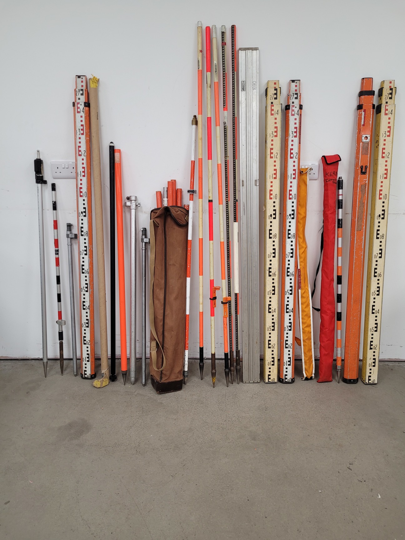 Large Lot of Surveying Equipment - Measuring Staffs, Rulers, Stakes, Sticks